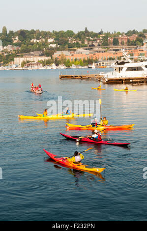 US, WA, Seattle Kayaks on racks, West Seattle frame the downtown ...
