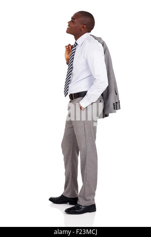 side view of man in coat with bag talking on smartphone near plane ...