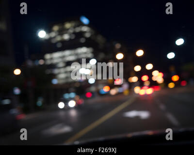 Blurred vision of a drunk driver during night drive in a city Stock ...