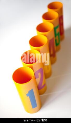 Yellow plastic cans numbered one to six - colored numbers Stock Photo ...