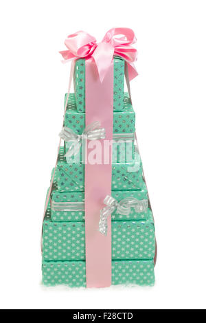 Stack of silver wrapped presents with a pink bow Stock Photo - Alamy