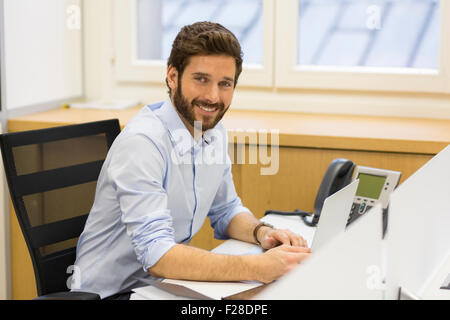 Portrait of young bearded hipster male with microphone headset on head ...