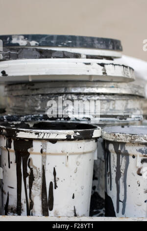 Photo of dirty plastic containers of paint Stock Photo - Alamy