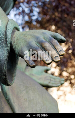 Hand of a bronze statue, Milan Stock Photo - Alamy