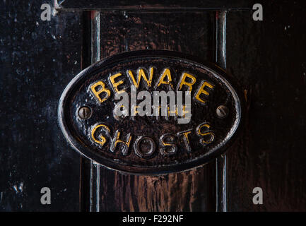 Warning sign for a haunted house Stock Photo - Alamy