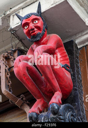 The famous Little Red Devil statue located in Stonegate, York Stock ...