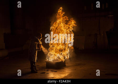 Firefighter extinguishes a heptane 2B-Pan fire with a 2-BTP ...
