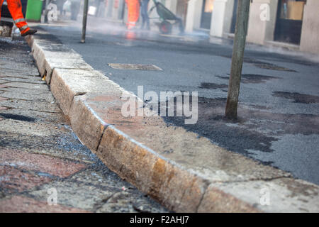 Photo of new Asphalt smoking Stock Photo - Alamy