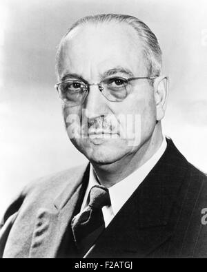 Dr. Karl A. Menninger, psychiatrist, playing a game with his family. Ca ...