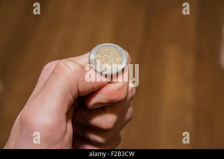 Tossing Euro coin, heads or tails you decide Stock Photo - Alamy