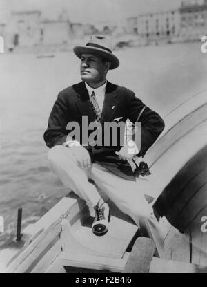 Benito Mussolini seated on boat, facing left, wearing summer suit. Ca ...