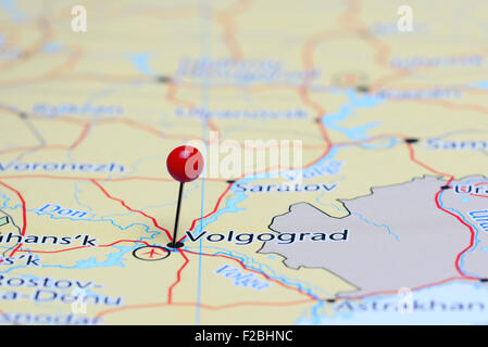 Close up to a Volgograd city with a red pin needle into Russia country ...
