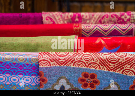 Rolls of textile, cloth and tissue of various colours on the market ...