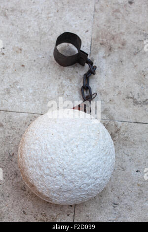 An prison inmate with a ball and chain Stock Photo - Alamy