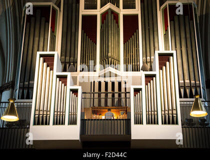 An organ keyboard instrument with beautiful religious decorations in a ...