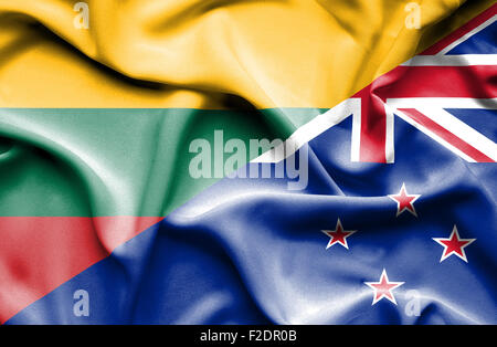 Lithuania flag and New Zealand flag waving together on blue sky, two ...