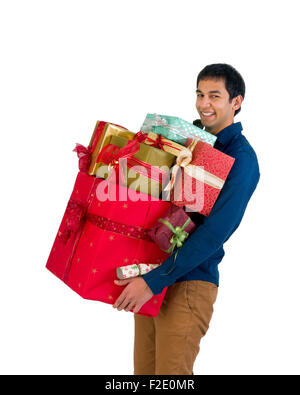 happy young man holding christmas gift and smiling at camera Stock ...