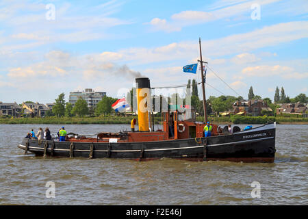 tug boat with yellow funnel Stock Photo - Alamy