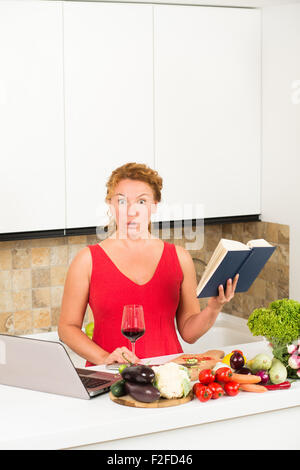 smiling middle aged housewife in white shirt with cup of coffee, hat ...