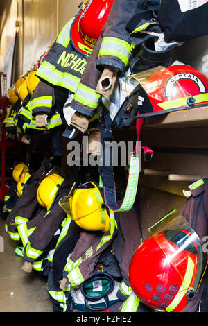 Fireman's gear and equipment hanging in lockers in a fire house Stock ...
