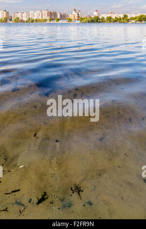 Obolon Skyline close to the Dnieper river in Kiev, Ukraine. Quiet water ...