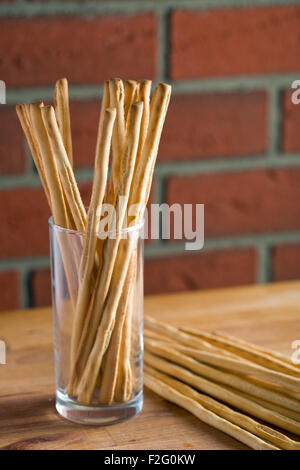 fresh and crunchy breadsticks on the table in restaurant Stock Photo ...