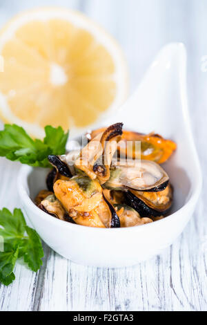 marinated mussels with parsley Stock Photo - Alamy