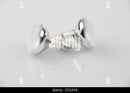 Two light bulbs isolated on white background Stock Photo - Alamy