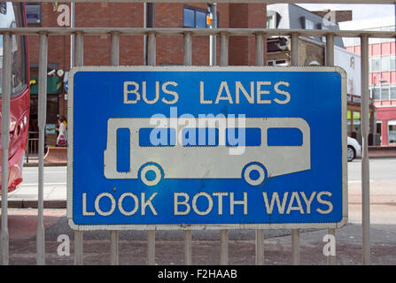 Bus lanes look both ways fixed penalty fine sign post in large open ...