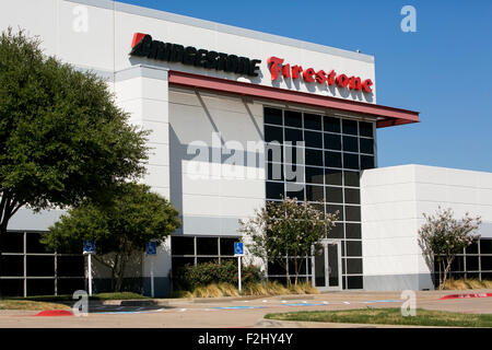 A logo sign outside of the Bridgestone Firestone agricultural tire ...