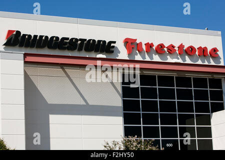 A logo sign outside of the Bridgestone Firestone agricultural tire ...