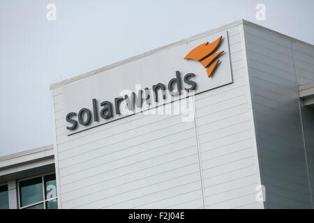 A logo sign outside of the headquarters of SolarWinds Inc., in Austin ...