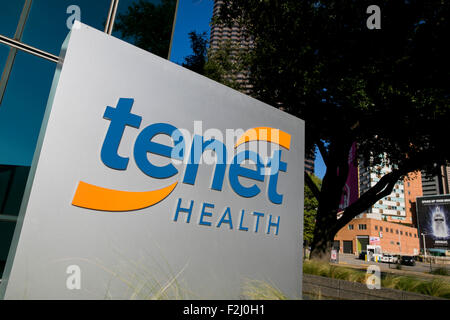 A logo sign outside of the headquarters of the Tenet Healthcare ...