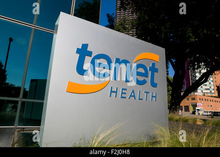A logo sign outside of the headquarters of the Tenet Healthcare ...