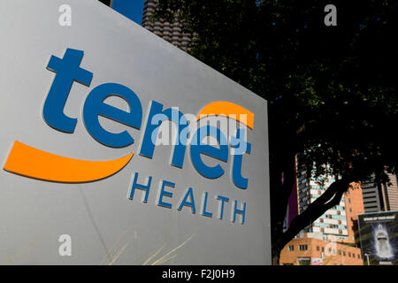 A logo sign outside of the headquarters of the Tenet Healthcare ...