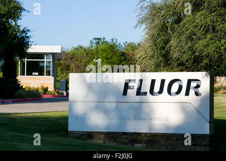 A logo sign outside of the headquarters of the Fluor Corporation in ...