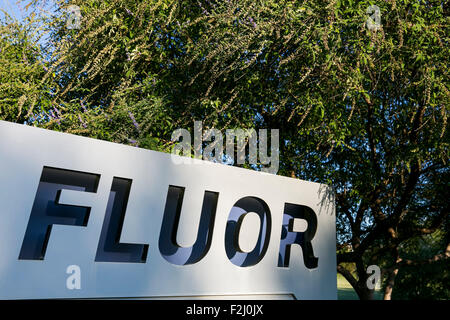 A logo sign outside of the headquarters of the Fluor Corporation in ...
