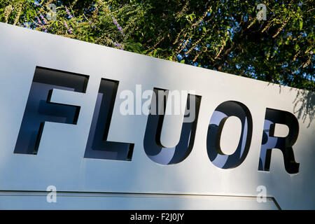 A logo sign outside of the headquarters of the Fluor Corporation in ...