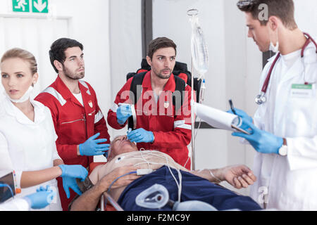 Hospital staff helping patient in emergency Stock Photo: 87780065 - Alamy