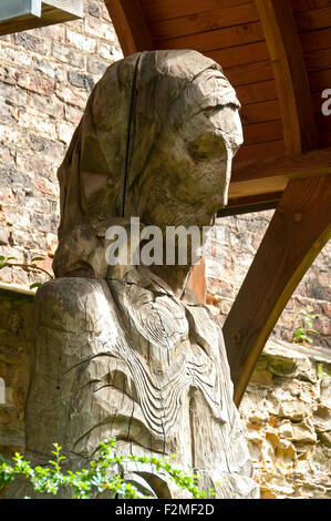 The sculpture Cuthbert of Farne by Fenwick Lawson in the ruins of ...