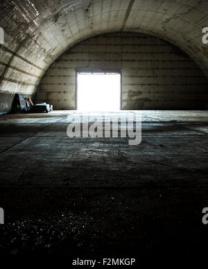 Old military hangar used to storage stuff Stock Photo - Alamy