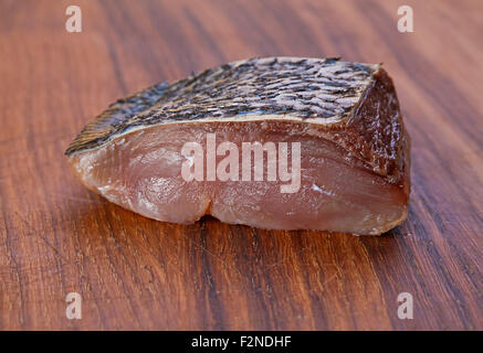 Carp fillet slice closeup on wood table Stock Photo - Alamy