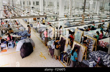 High angle view of female worker packing goods wrapped in packet in the ...