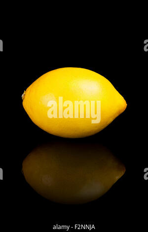 lemon on reflective surface Stock Photo - Alamy