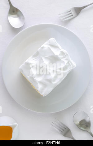 White cake for tea break moment on white background Stock Photo - Alamy