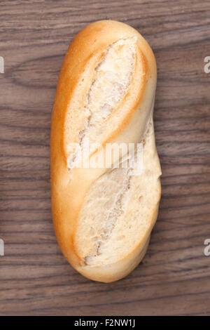 Homemade wholemeal bread with small loaf of bread on white background ...