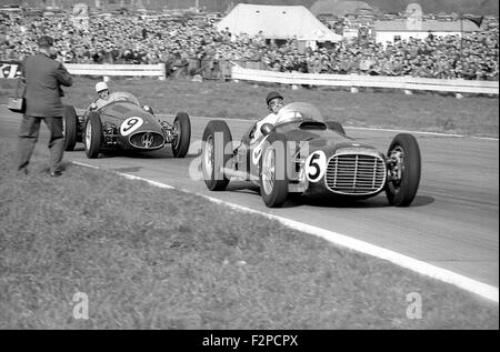 Ken Wharton in a BRM V16 leads Roy Salvadori in a Maserati 250F before ...