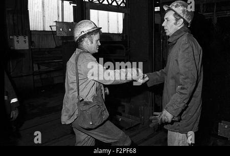 Miners emerging in the cage after completing a shift on the coal face ...