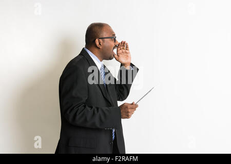indian businessman with tablet shouting and shock Stock Photo - Alamy