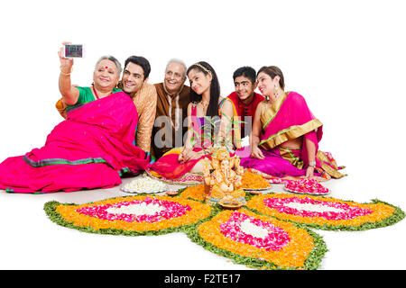 Portrait of three generation family clicking selfie together at home on ...